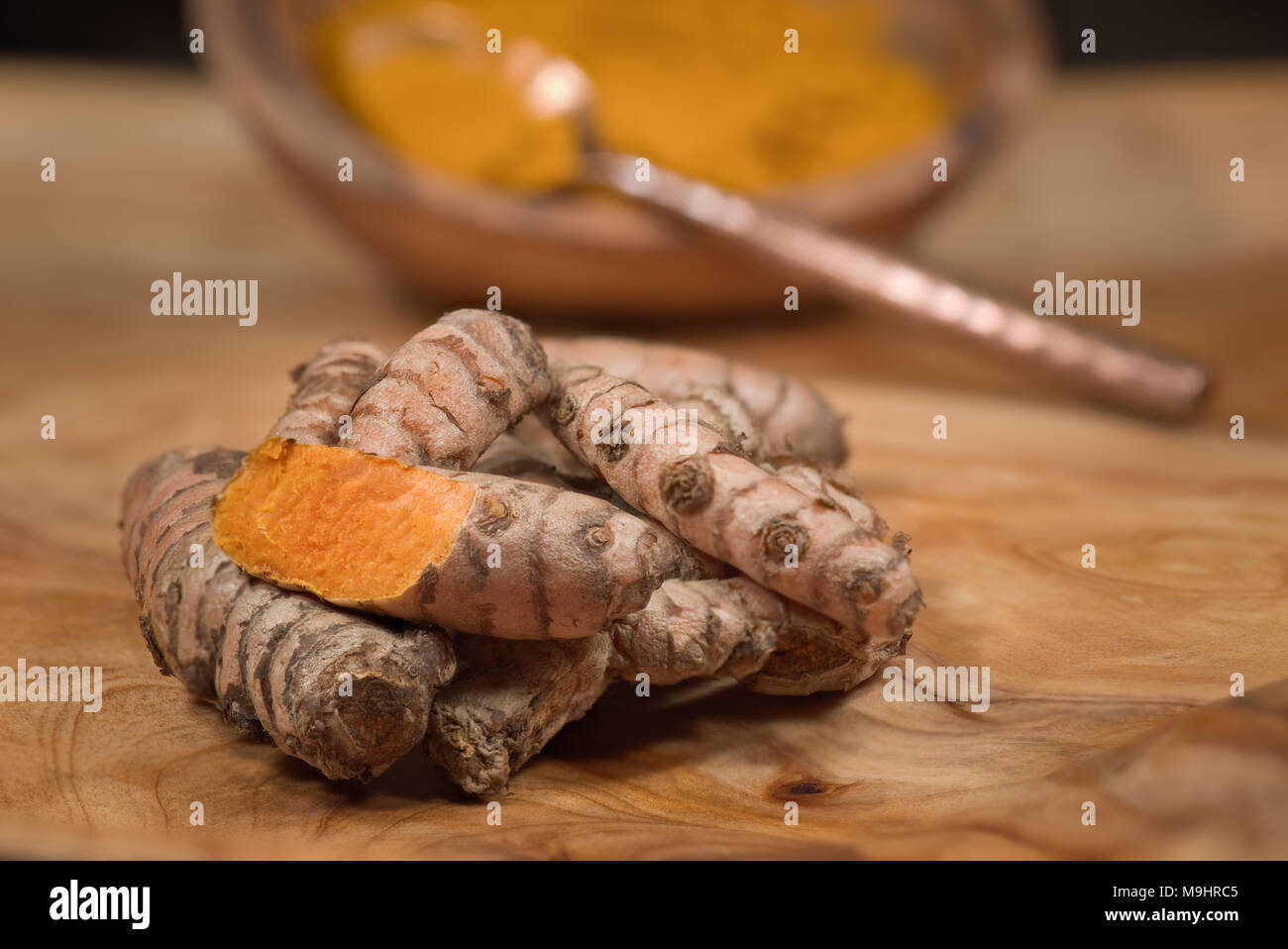 Turmeric root One piece of root cut open showing inside. Turmeric in ... Turmeric root One piece of root cut open showing inside. Turmeric in ...