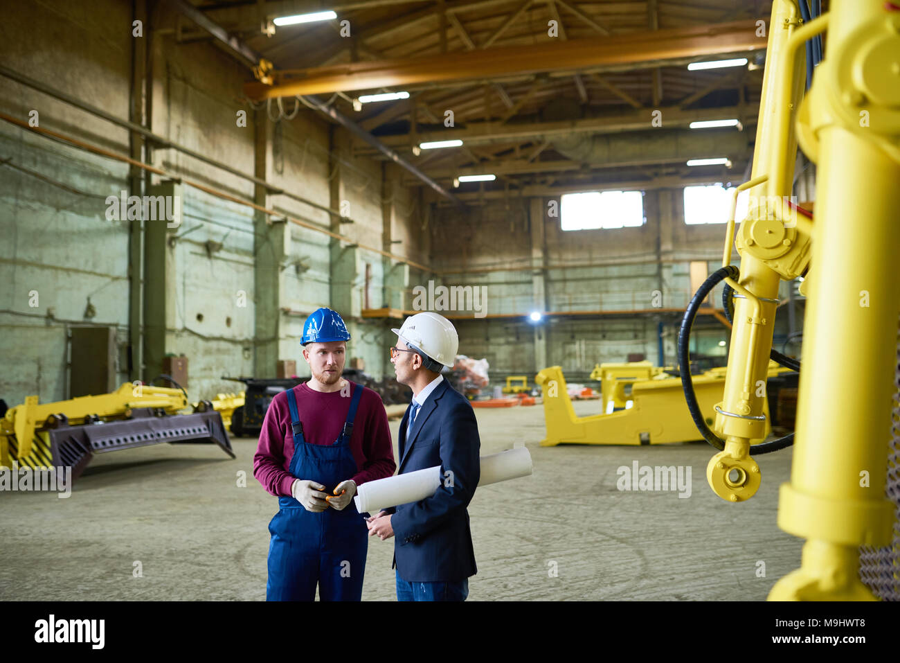 Factory Workers in Workshop Stock Photo - Alamy