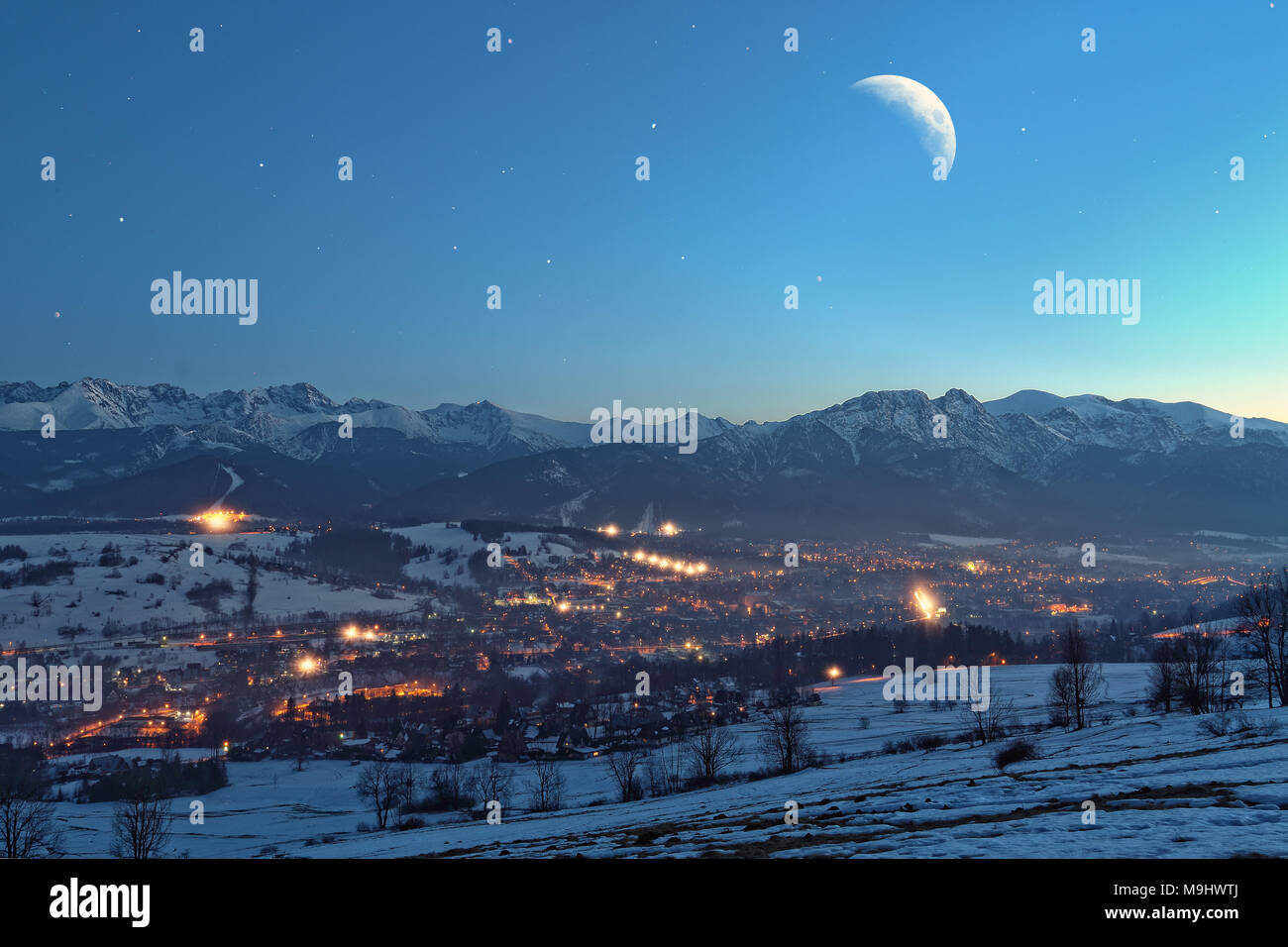Night view of the mountain town Stock Photo - Alamy