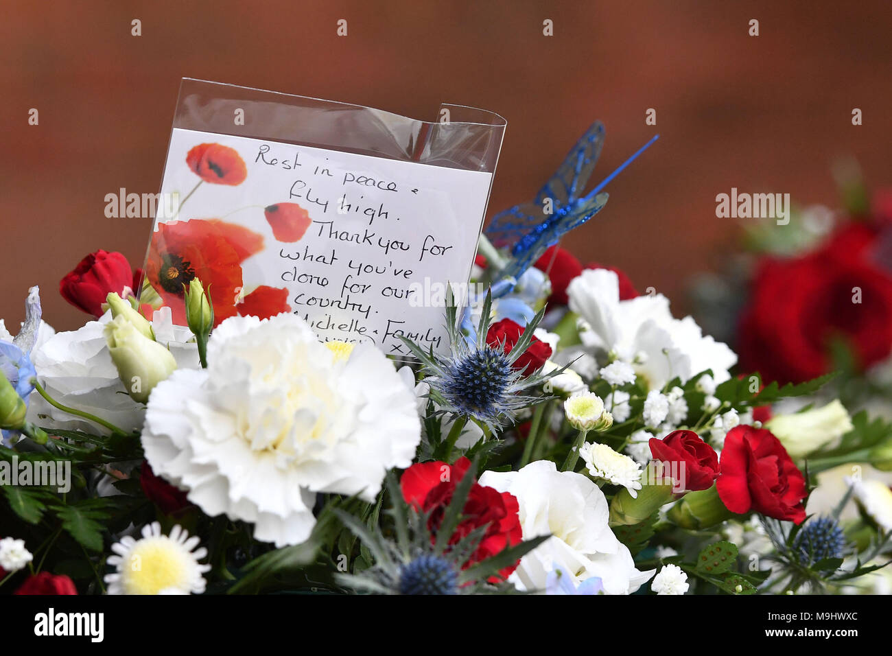 Tributes on flowers at the funeral of Kenneth White, an RAF veteran who ...