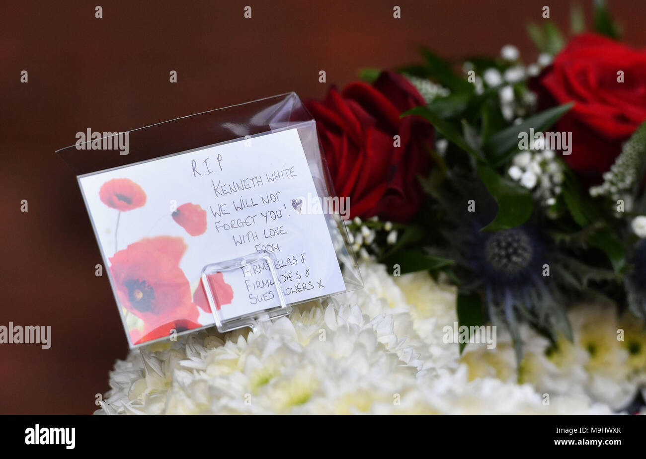 Tributes on flowers at the funeral of Kenneth White, an RAF veteran who ...