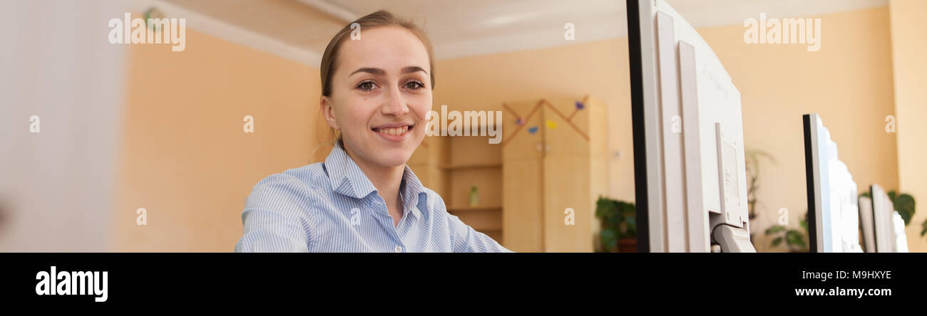 Concentrated businesswoman trying to solve a difficult assignment on ...