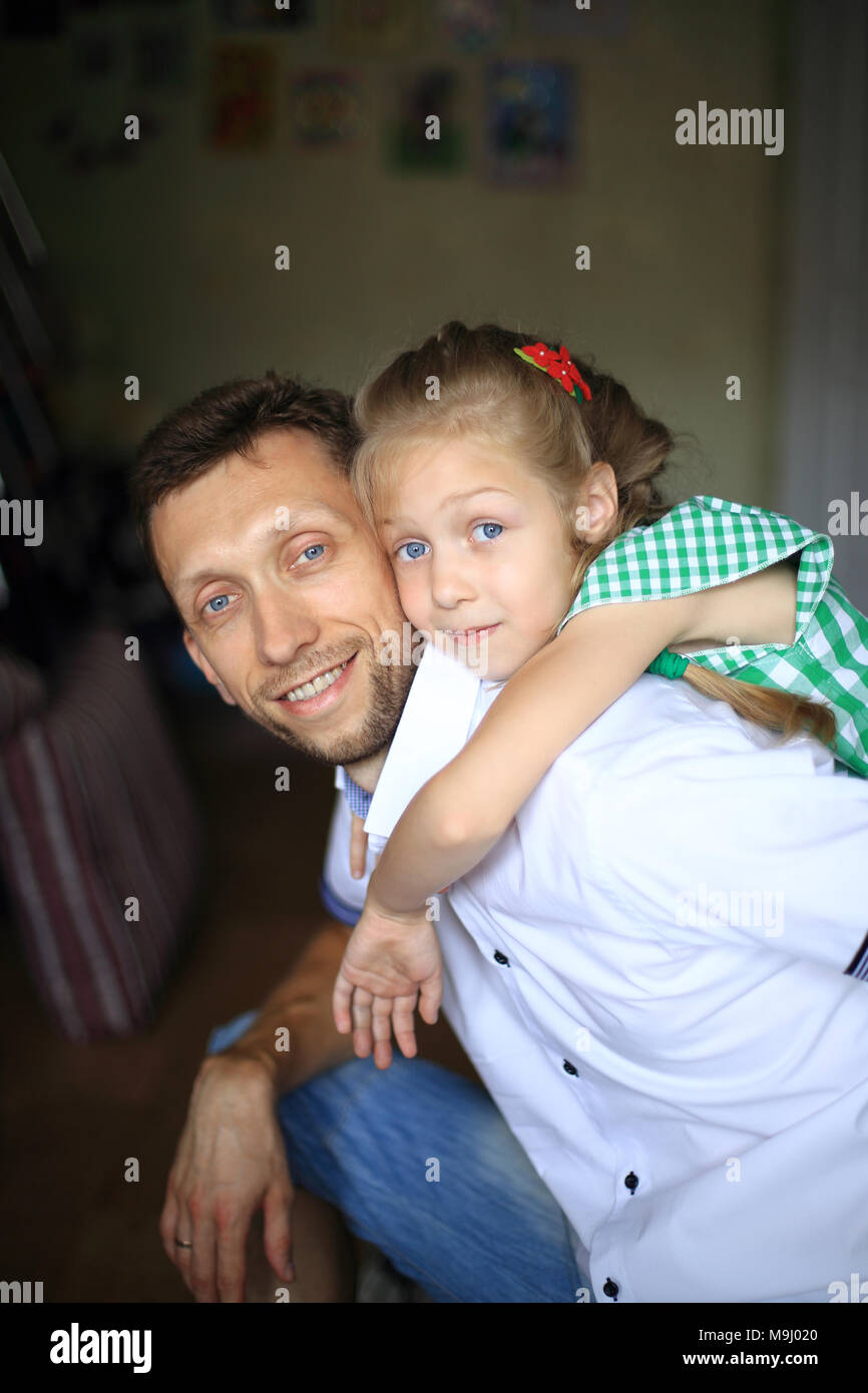 concept of raising children - a little girl hugging her beloved Stock ...