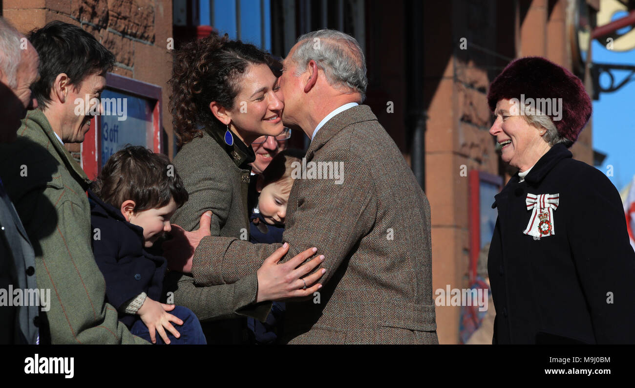 The Prince of Wales is greeted by a welcome party including local MP ...
