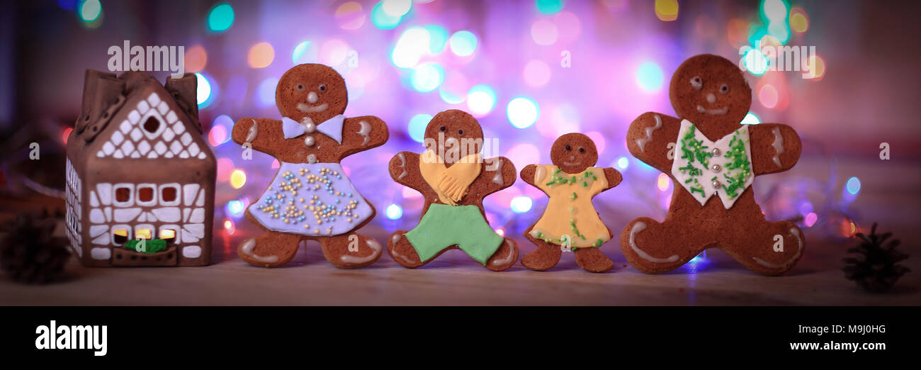 gingerbread house and gingerbread men on a festive background Stock ...