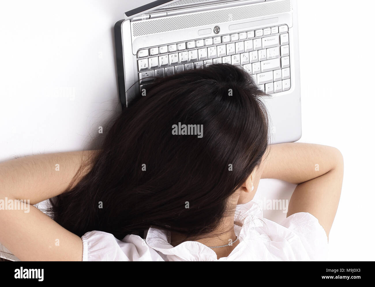 closeup.a young employee falling asleep on the laptop keyboard Stock ...