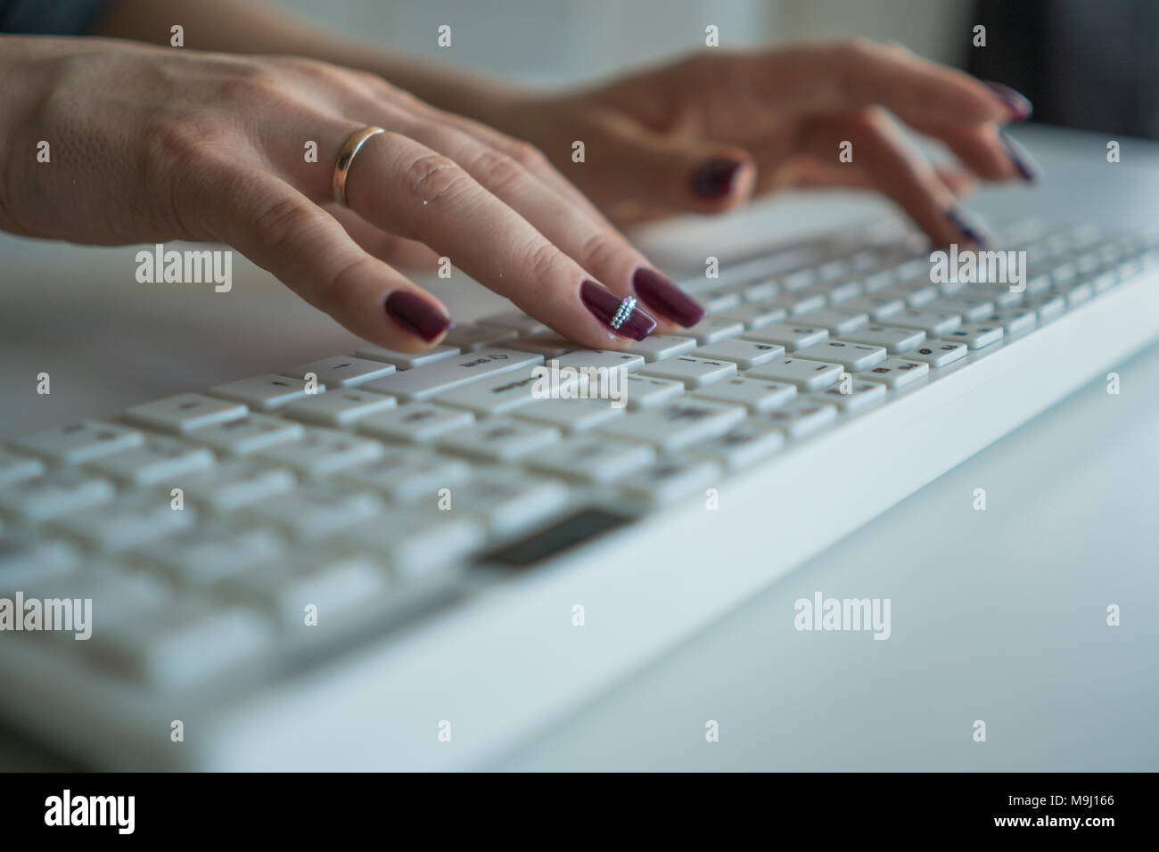 Beautiful female hands on a computer keyboard close-up Stock Photo - Alamy
