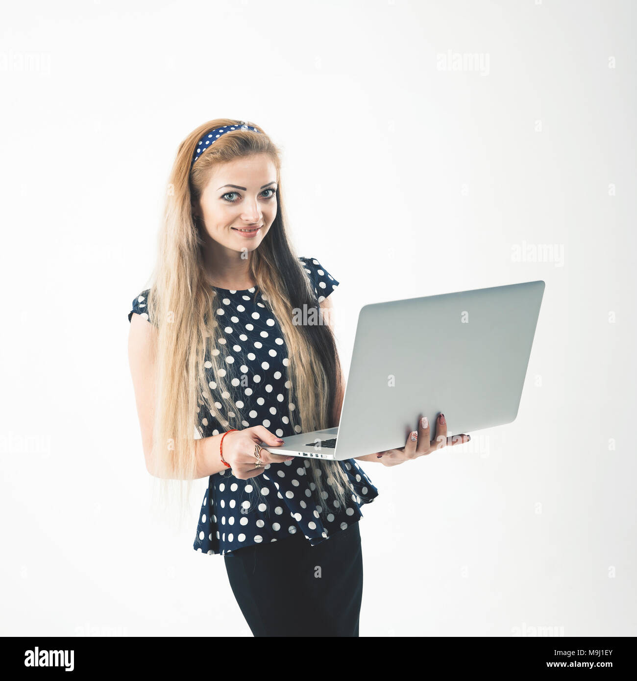 portrait of confident female administrator with an open laptop o Stock ...