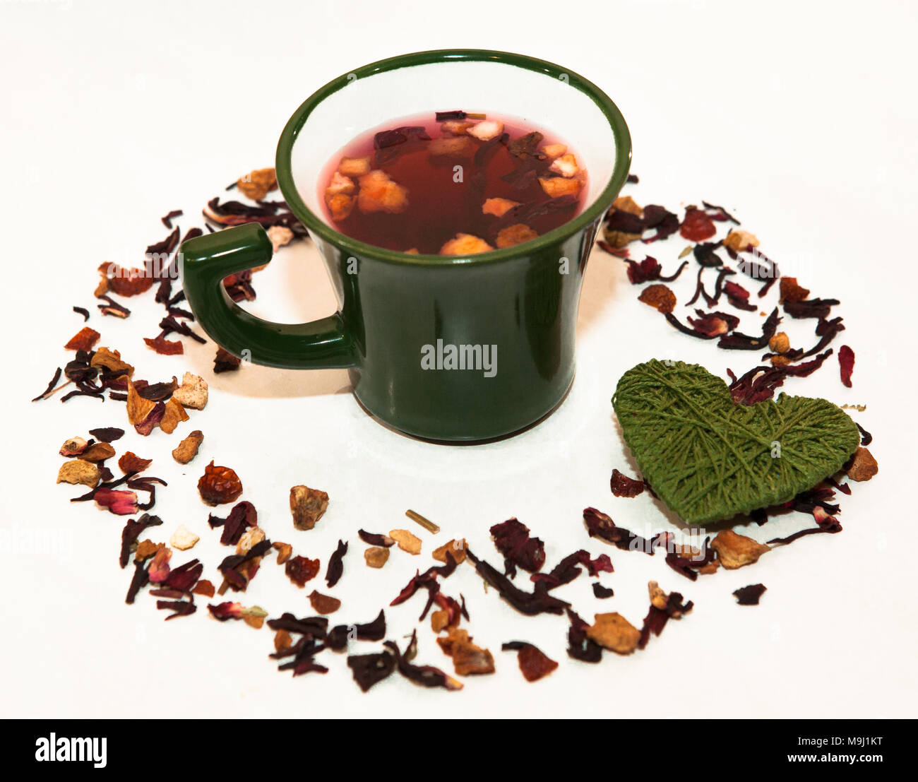 composition with tea karkade in green cup on white background Stock ...
