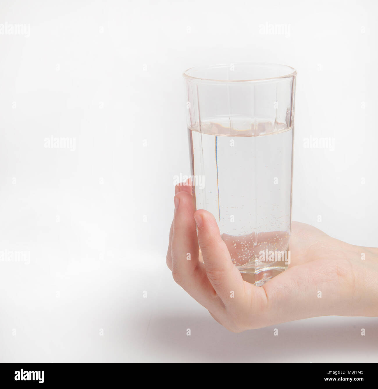 Woman hand with glass of water isolated on white background Stock Photo ...