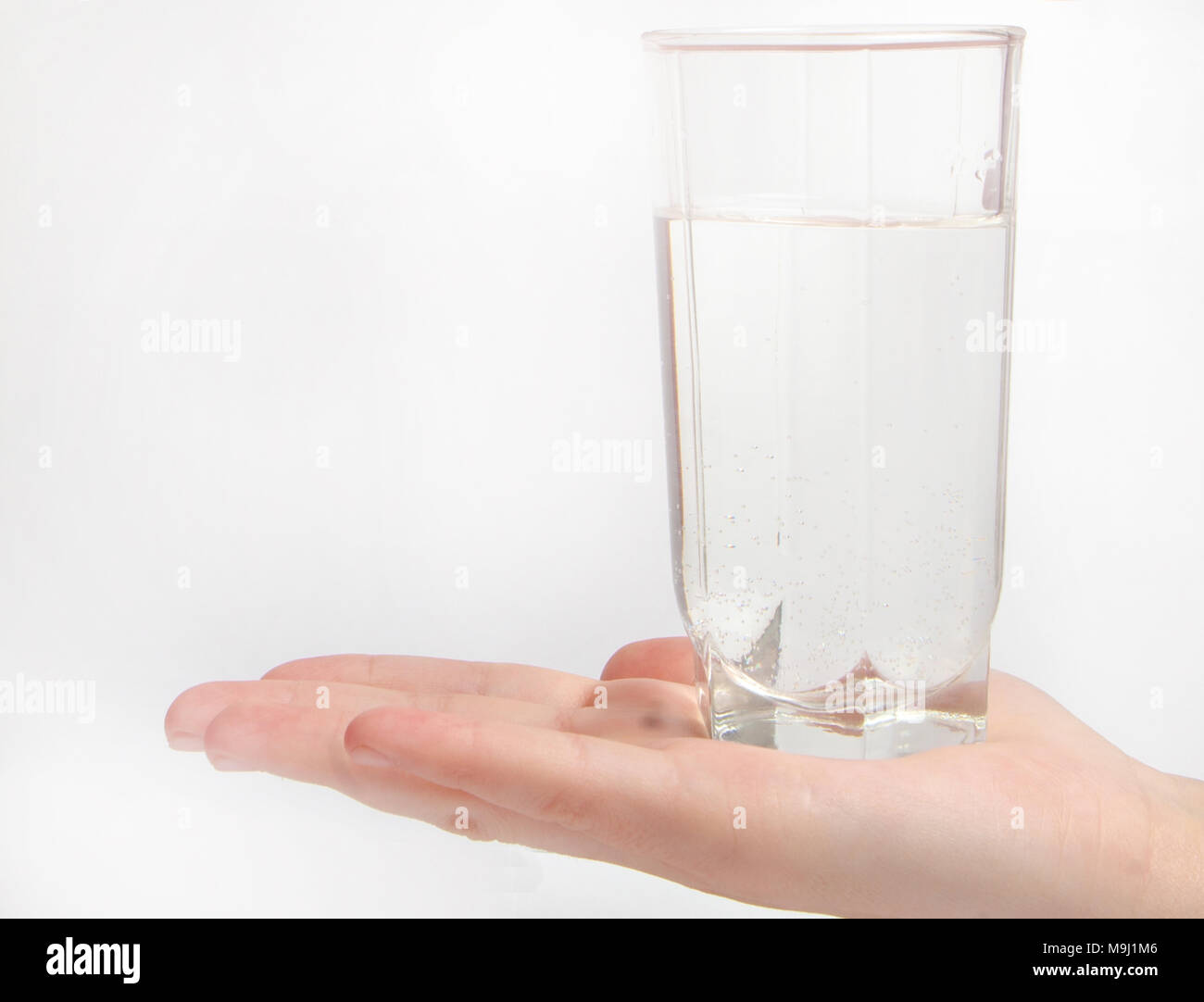 Woman hand with glass of water isolated on white background Stock Photo ...