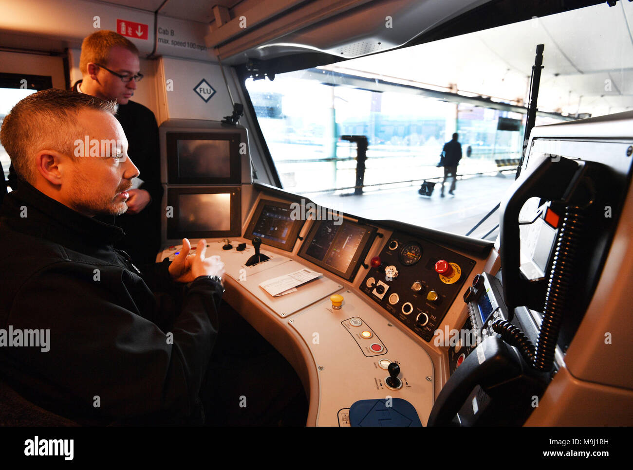 A driver after pressing the ATO (Automatic Train Operation) button on a ...