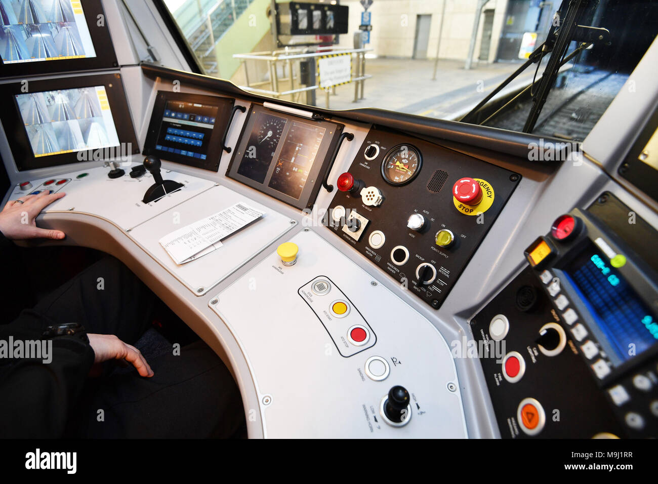 The ATO (Automatic Train Operation) centre yellow button of three in ...