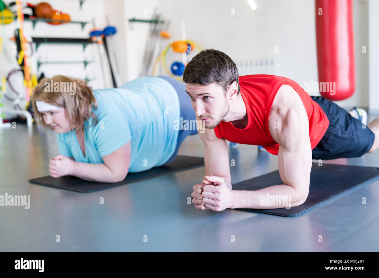 Fitness Instructor Working with Client Stock Photo - Alamy