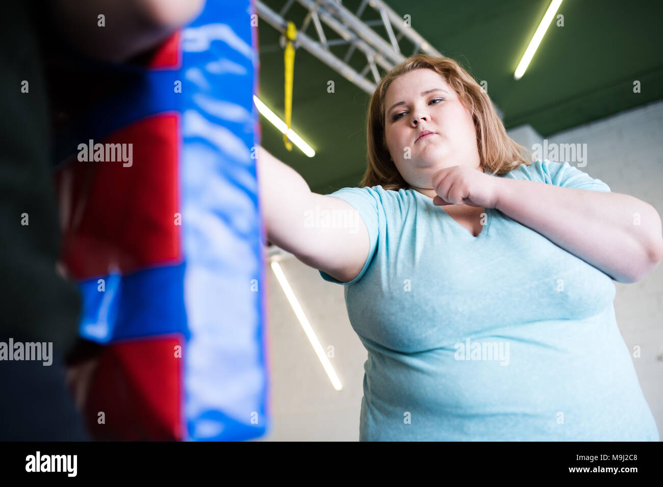 Strong Obese Woman Boxing in Gym Stock Photo - Alamy