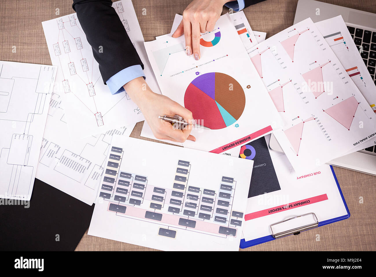 Multiple charts and diagrams on the table Stock Photo - Alamy