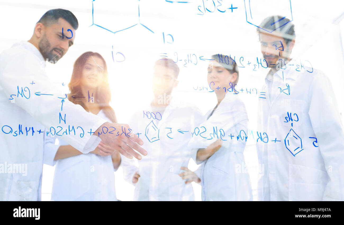 in the background image group laboratory scientists discussing their ...