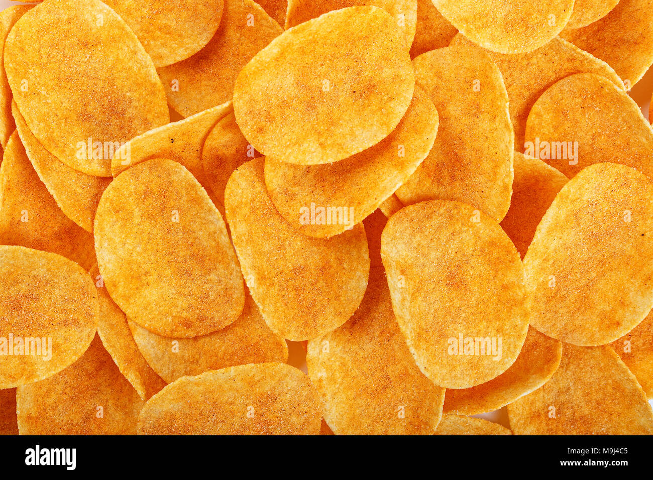 background golden chips with texture. top view Stock Photo - Alamy