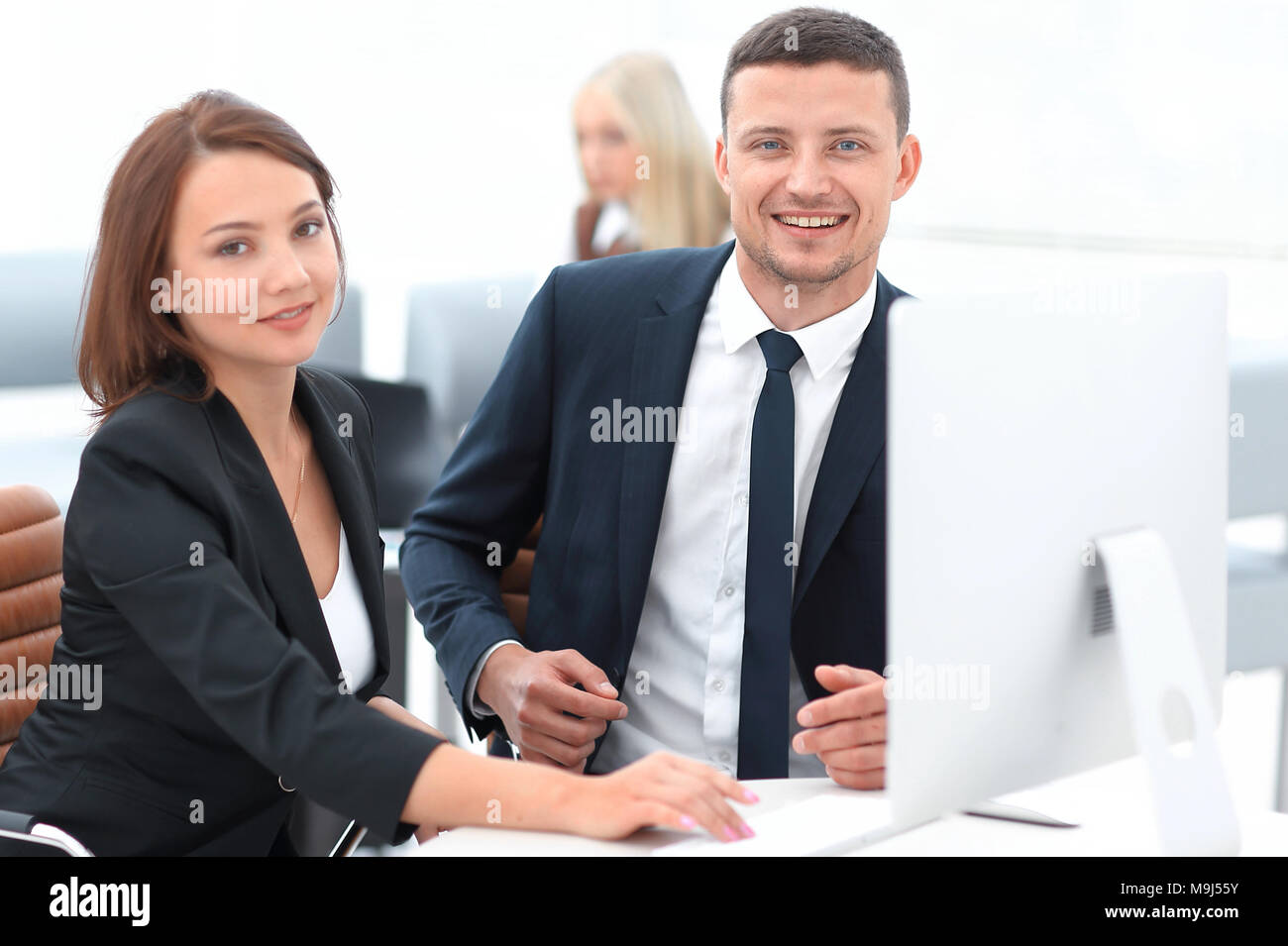 Experienced company employees sitting hi-res stock photography and ...