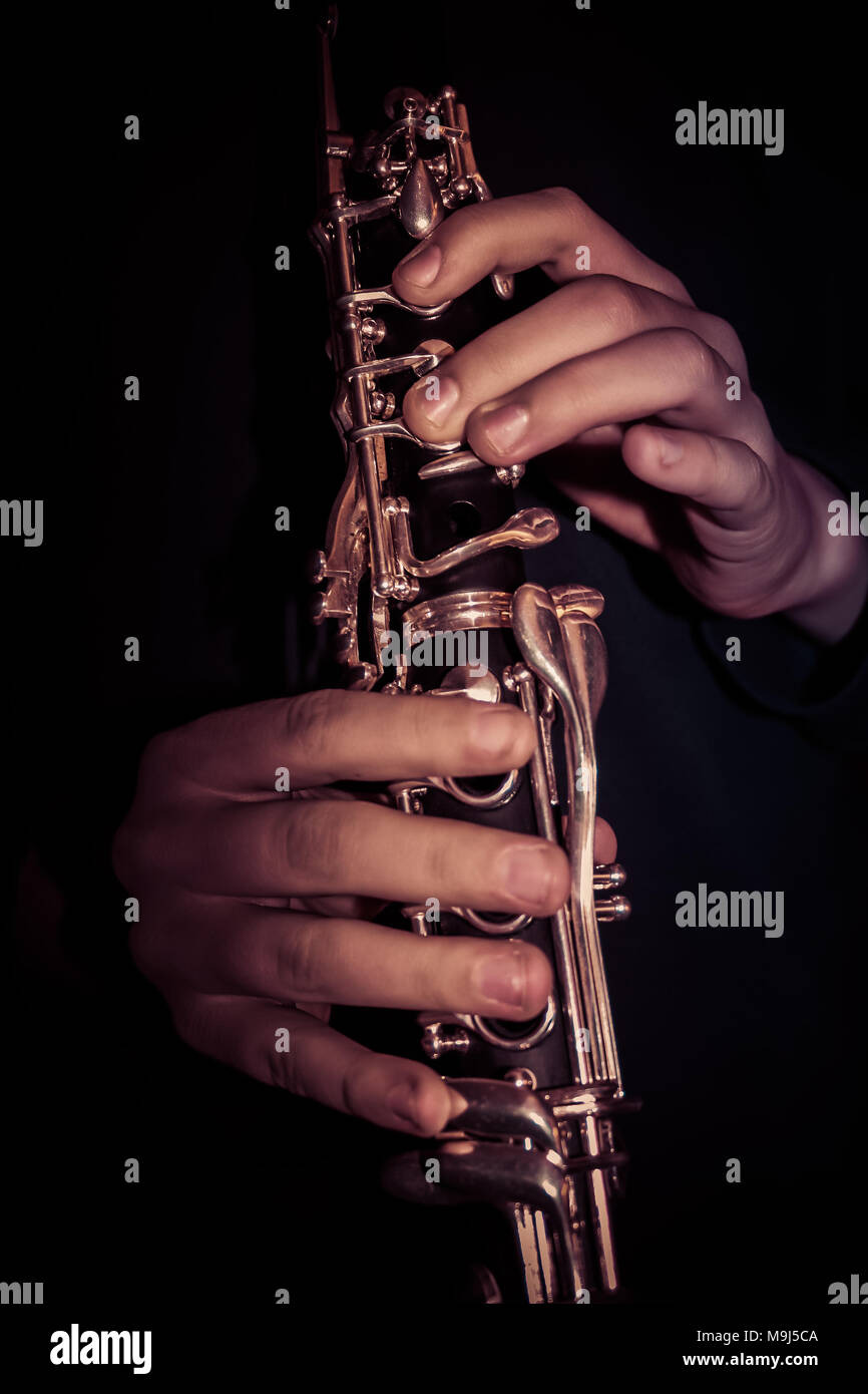 Hands playing clarinet hi-res stock photography and images - Alamy