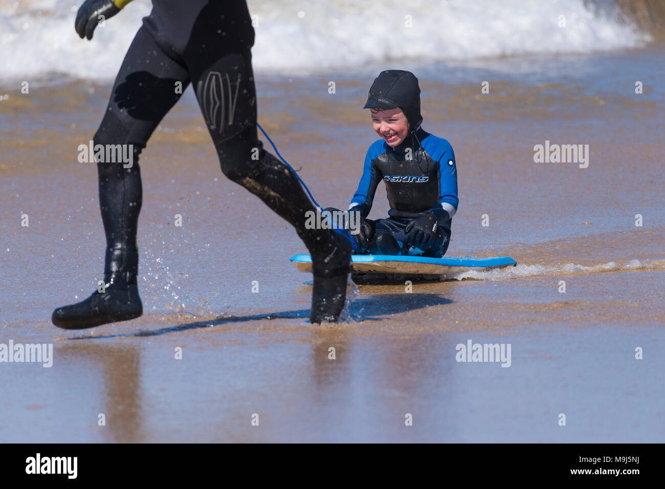 Young boy with bodyboard hi-res stock photography and images - Alamy
