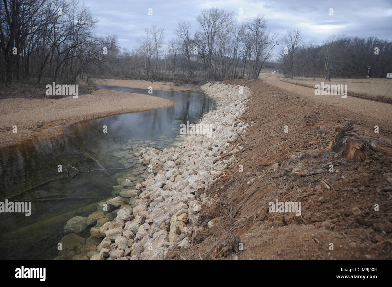 Upstream view of completed longitudinal fill stone toe protection and ...