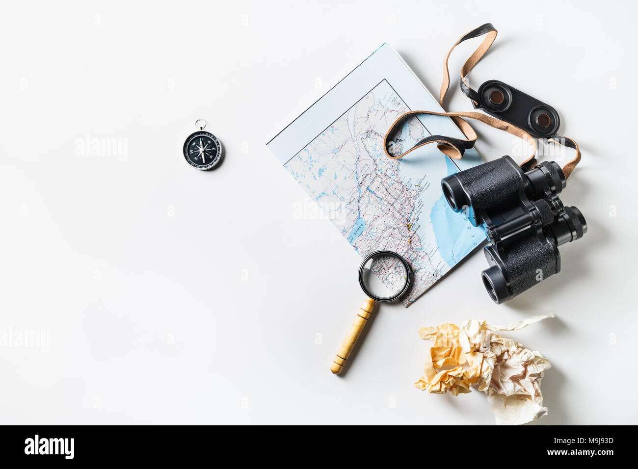 Travel plan background. Map, binoculars, compass, magnifier and ...