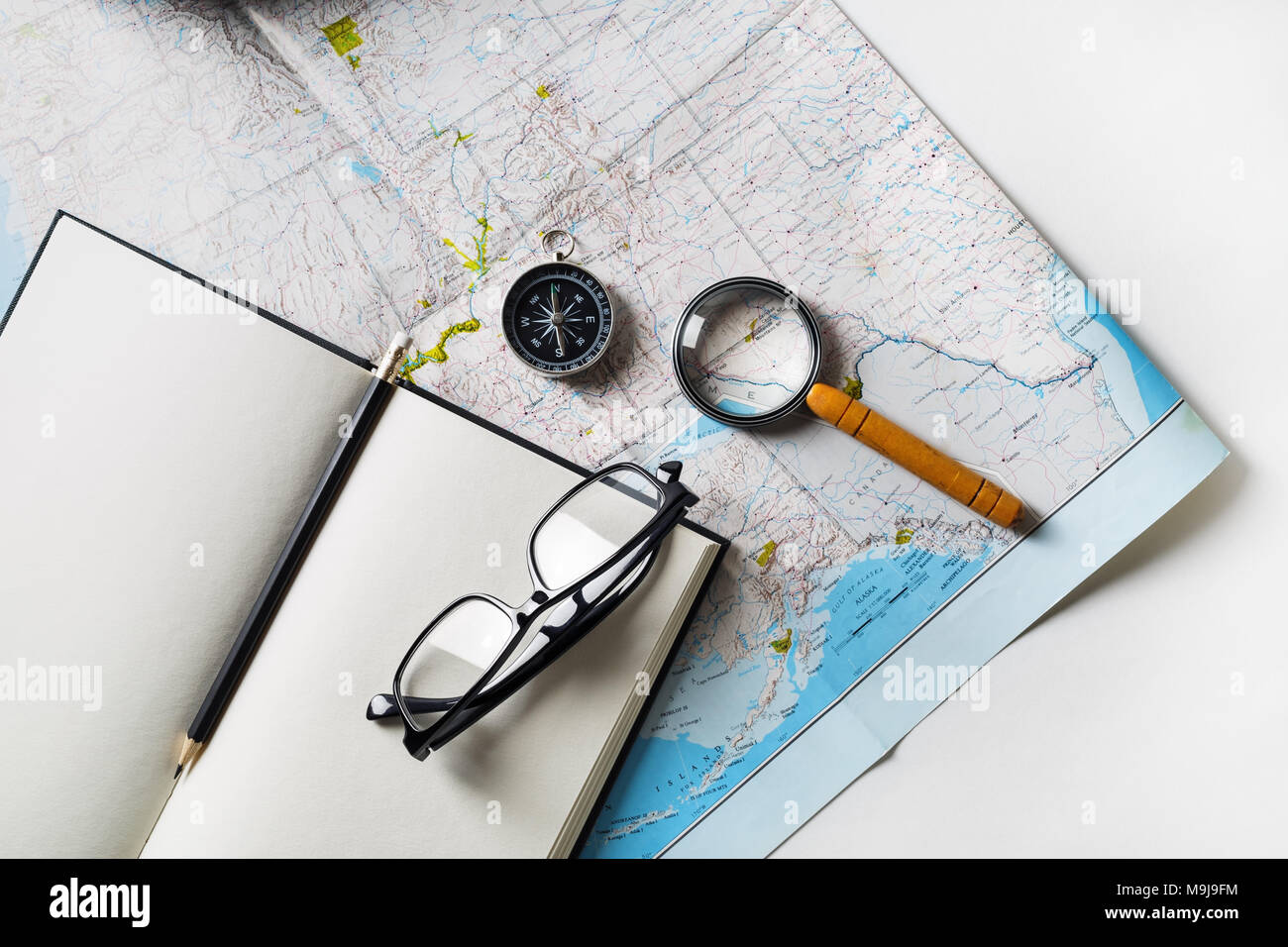 Travel plan background. Ready for the trip. Map, blank notebook ...