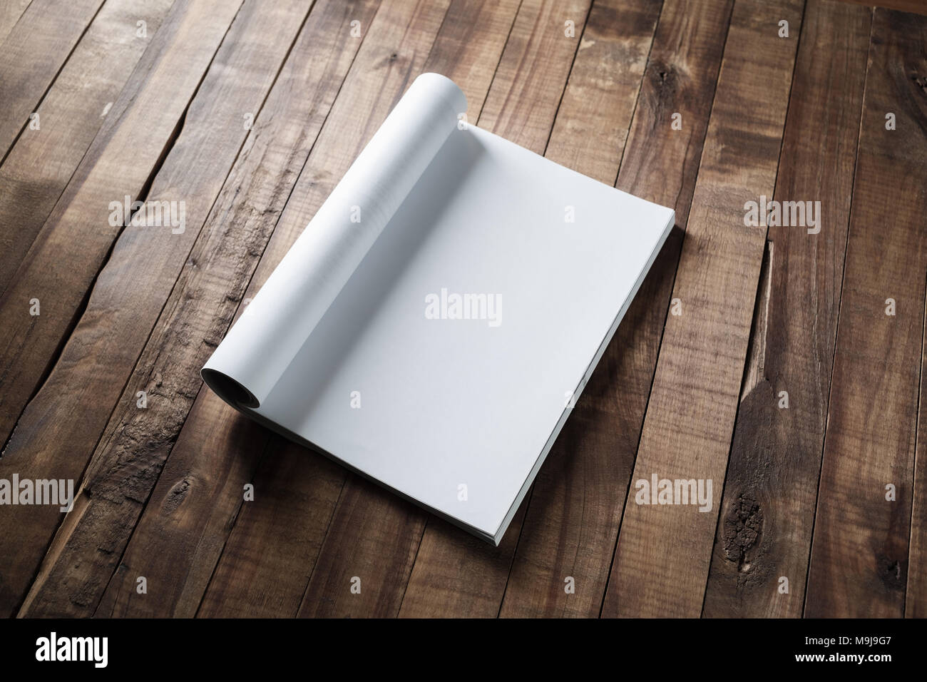 Blank magazine pages on wooden table background Stock Photo - Alamy