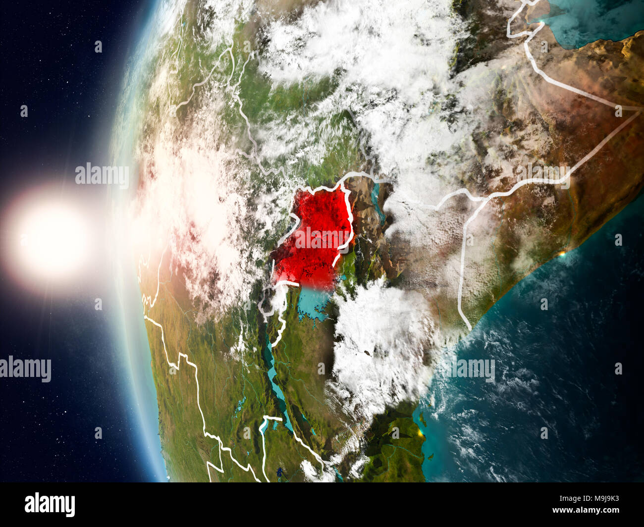 Satellite view of Uganda highlighted in red on planet Earth with clouds ...