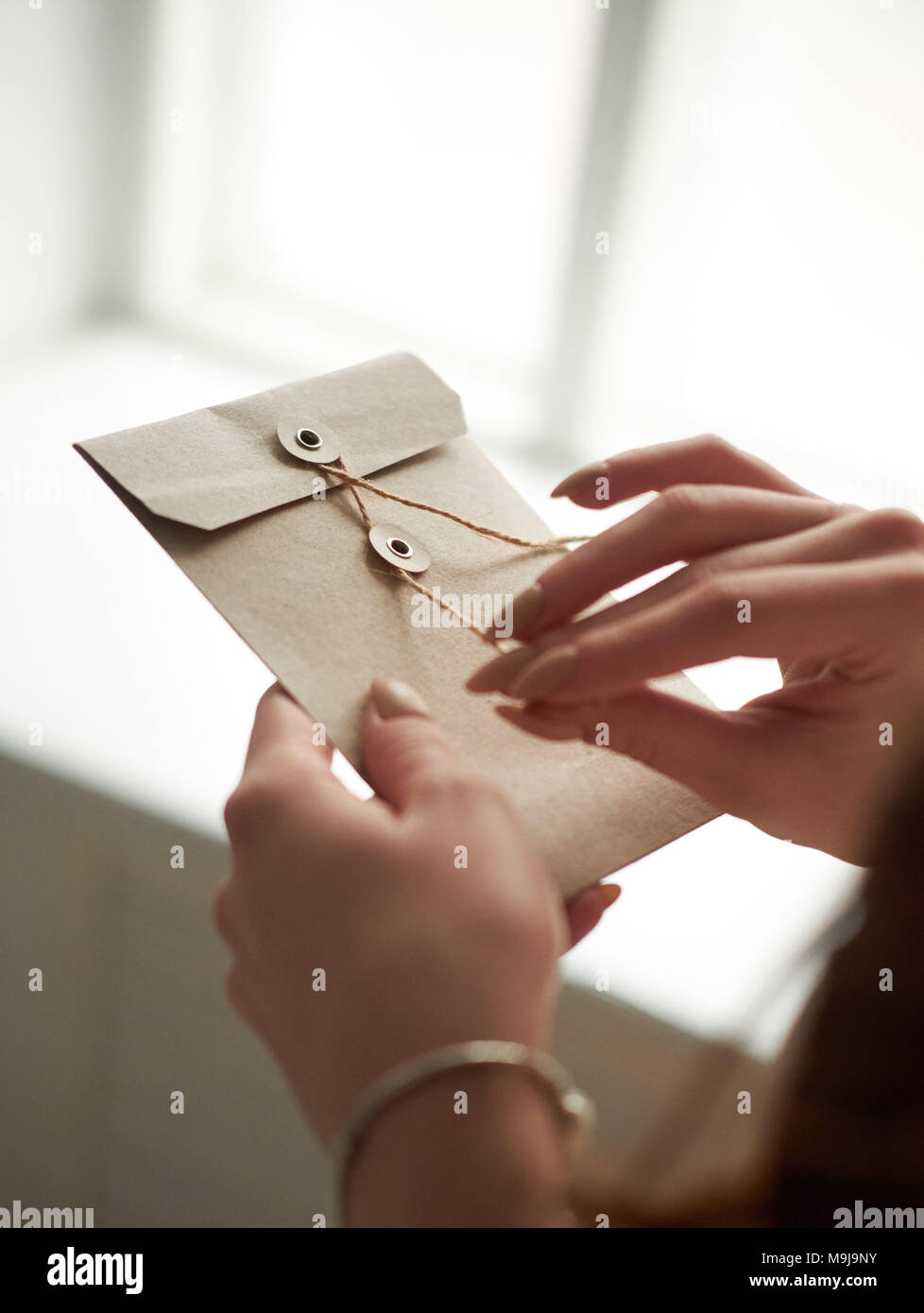 Hand out envelope hi-res stock photography and images - Alamy