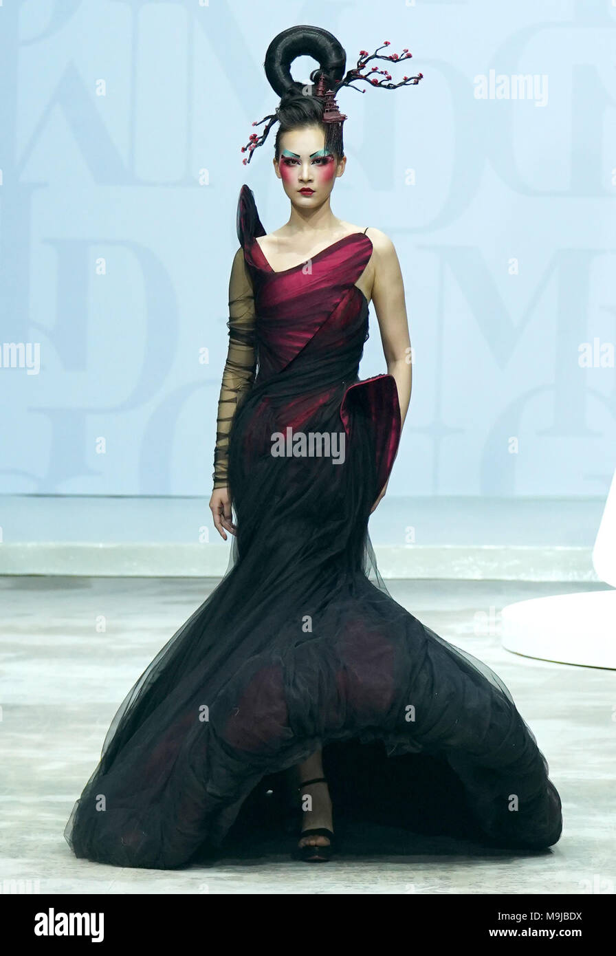 Beijing, China. 26th Mar, 2018. A model shows the make-up designed by ...