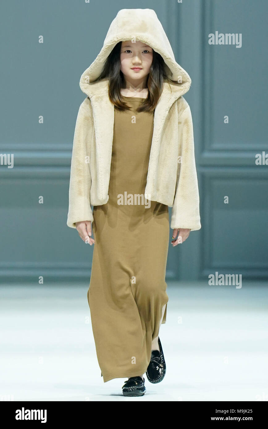 Beijing, China. 27th Mar, 2018. A model presents a creation of LE ...