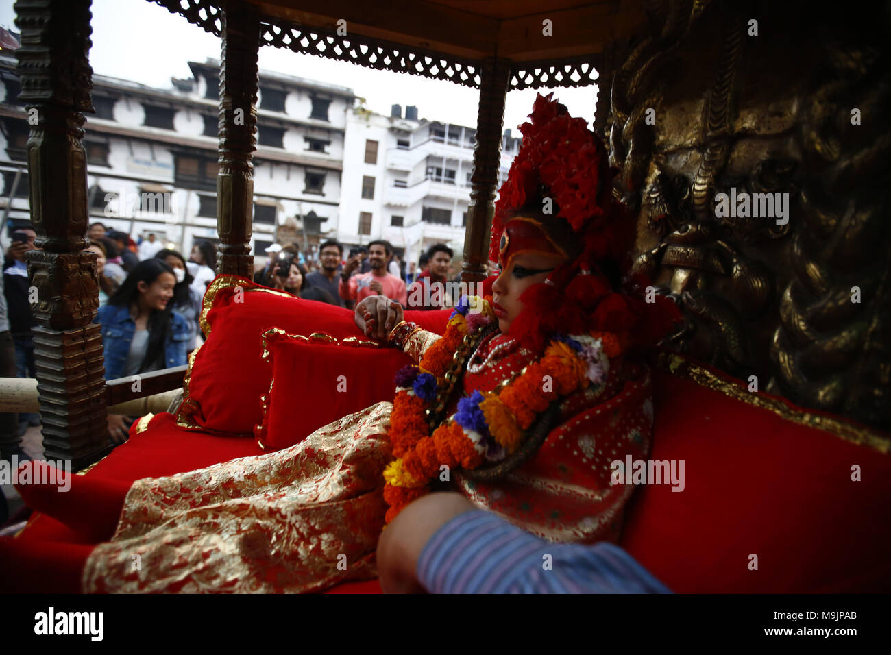 Kathmandu, Nepal. 27th Mar, 2018. Living Goddess, Kumari, is carried on ...