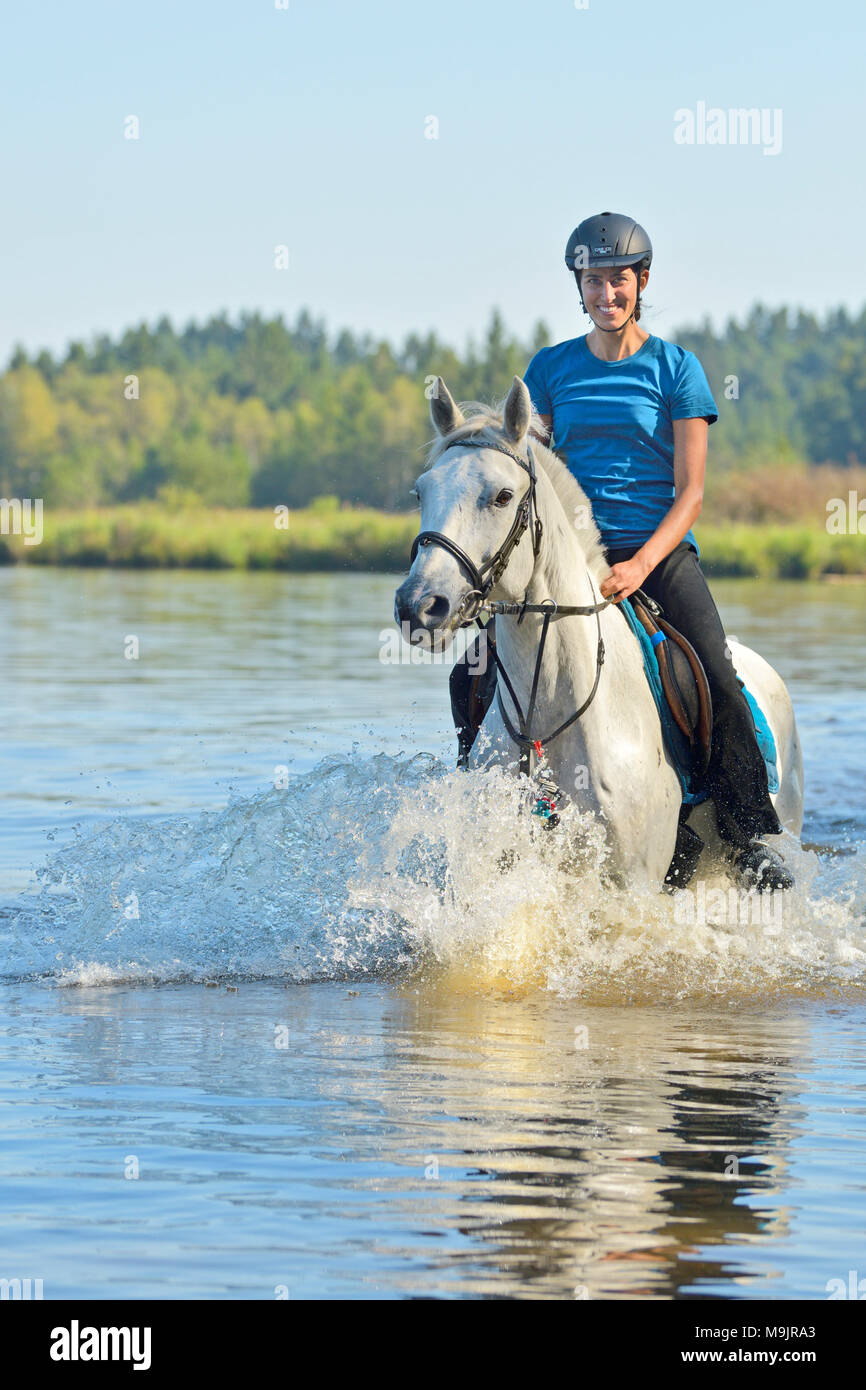 Woman riding pony hi-res stock photography and images - Alamy