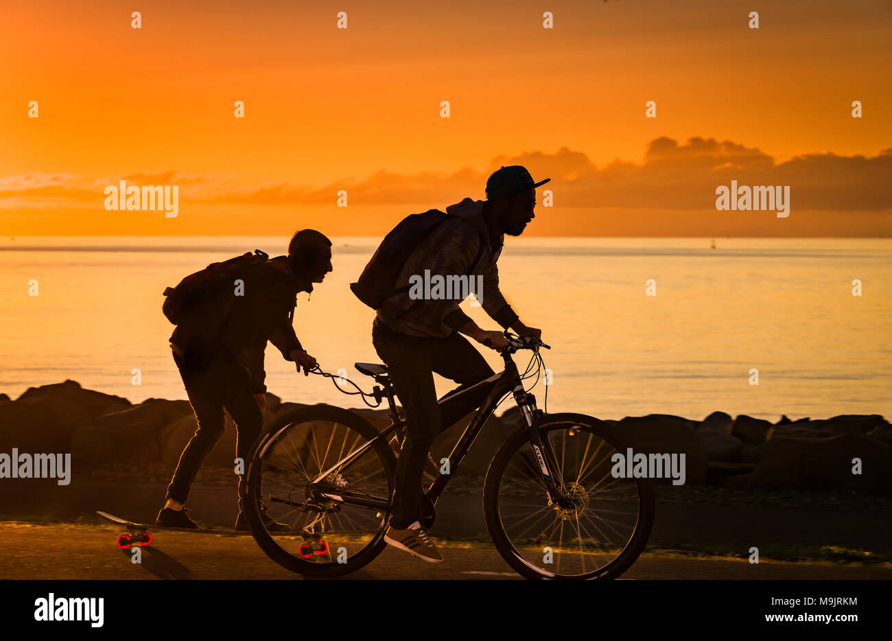 Riding bike sunset hi-res stock photography and images - Alamy