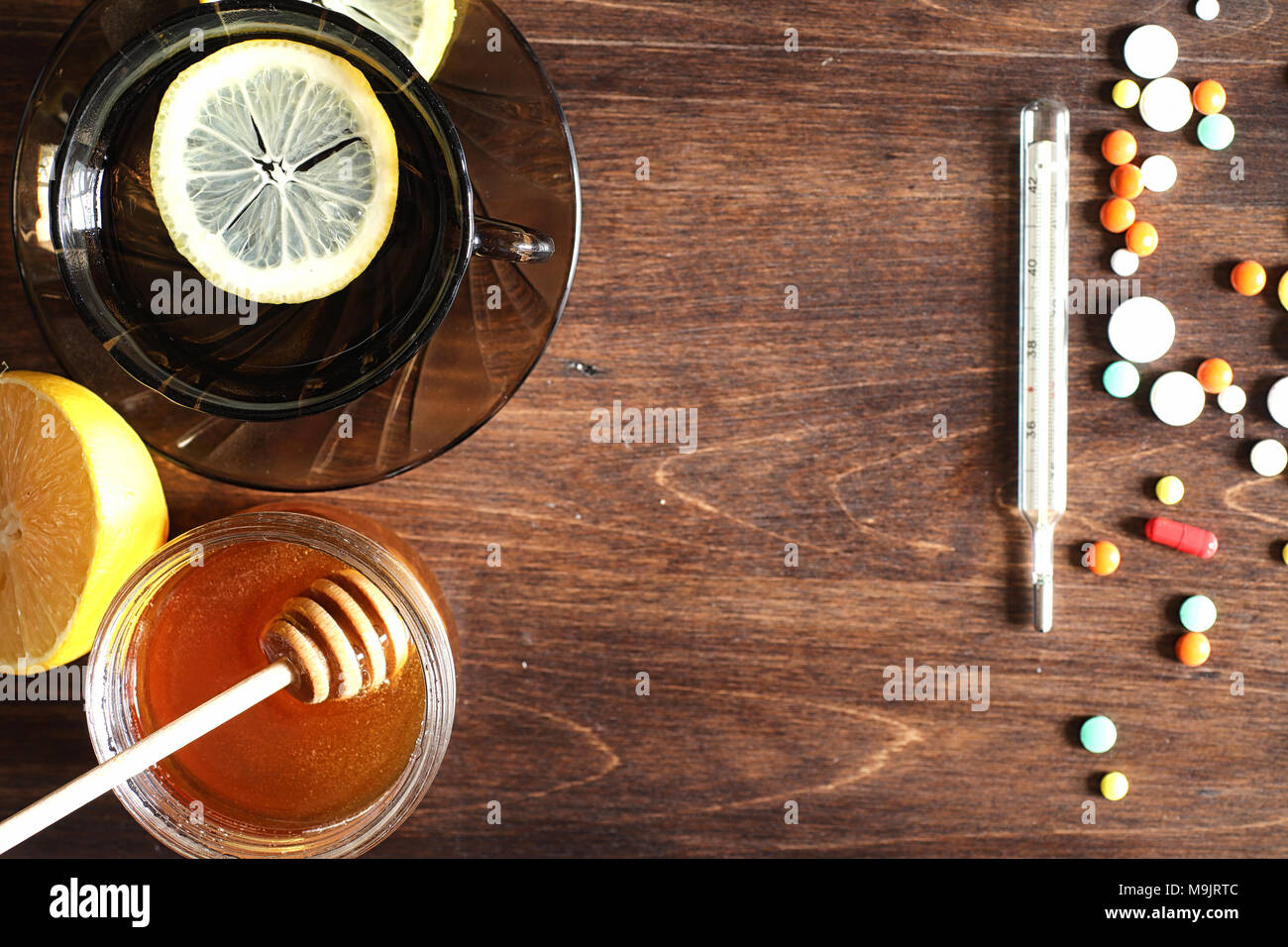 Tablets and home remedies against colds Stock Photo - Alamy