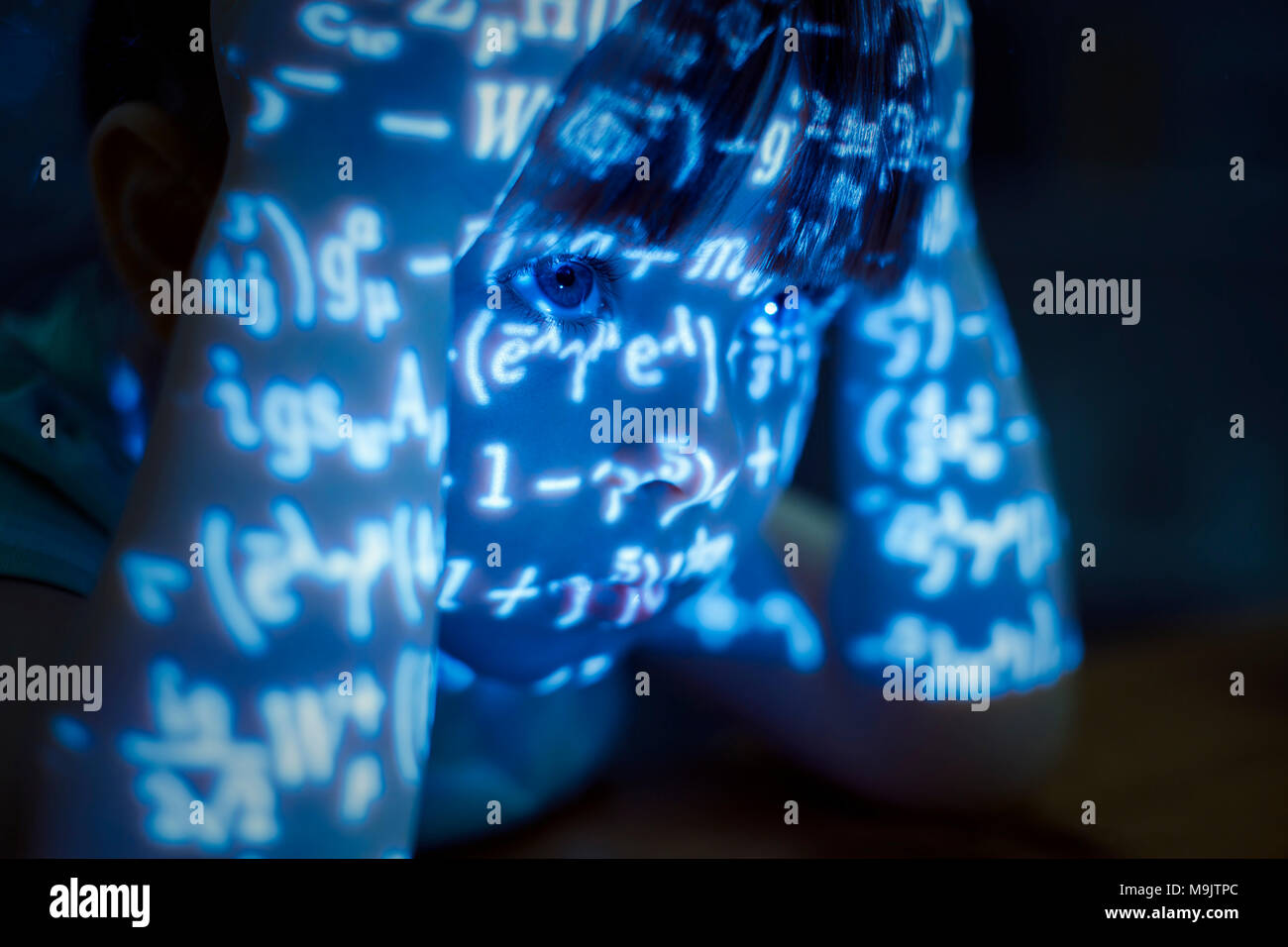 Funny little girl trying solve a math problem. Education concept Stock ...