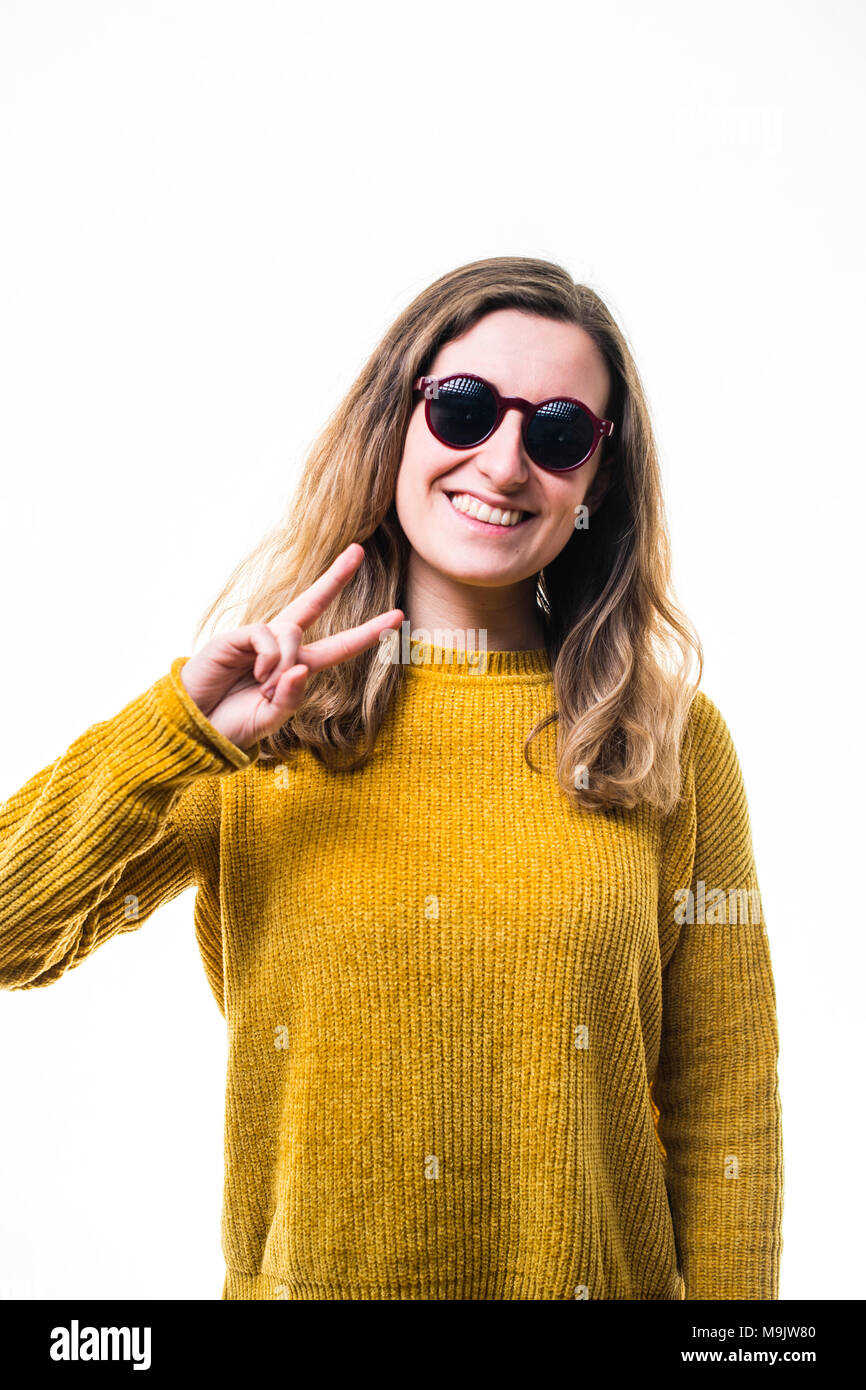 A happy smiling positive young Caucasian woman girl wearing a yellow ...