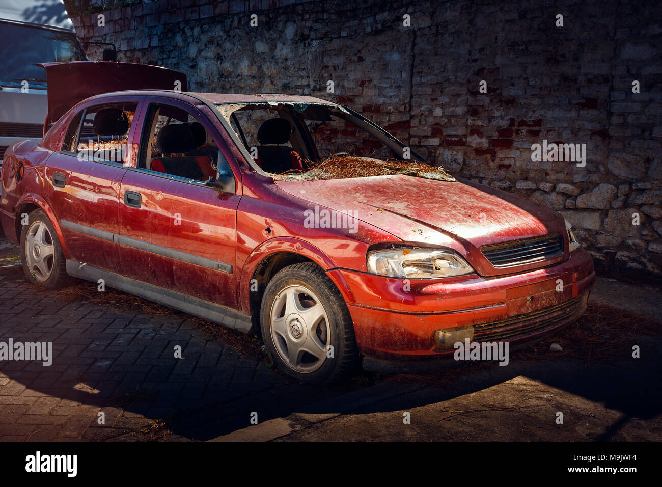 Damaged Red Car