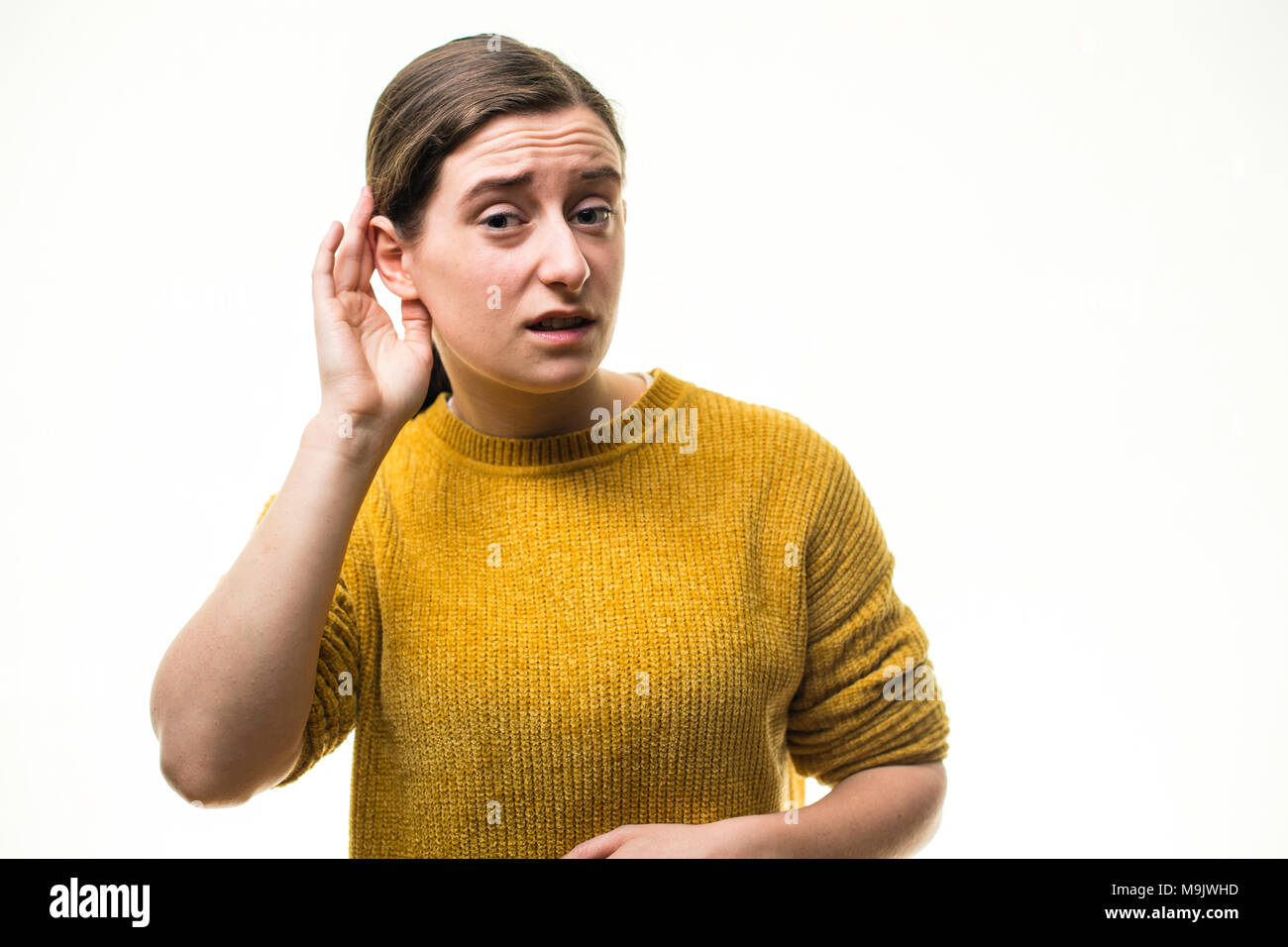 Woman cupping ears hi-res stock photography and images - Alamy
