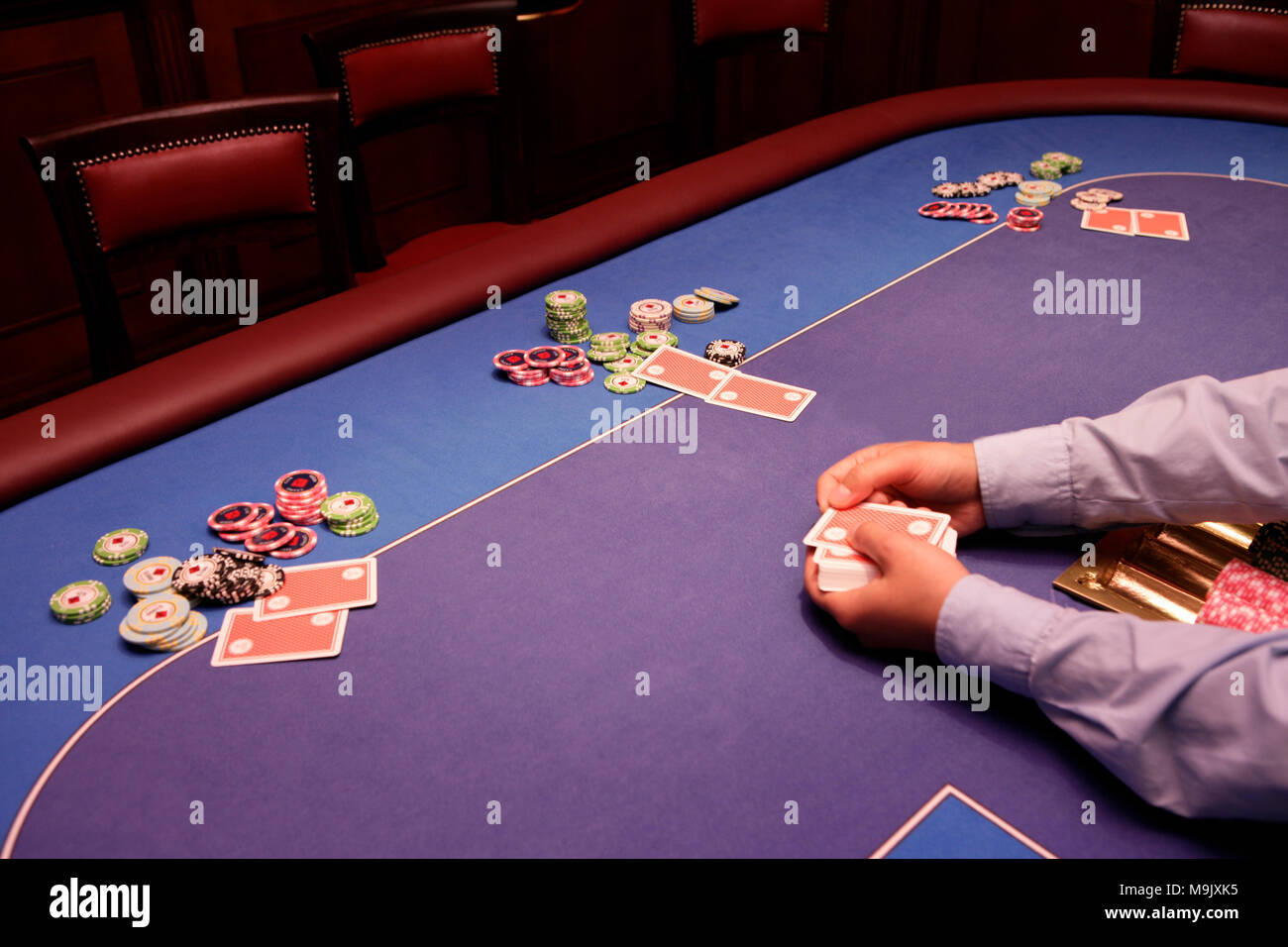 Card player checks hand hi-res stock photography and images - Alamy