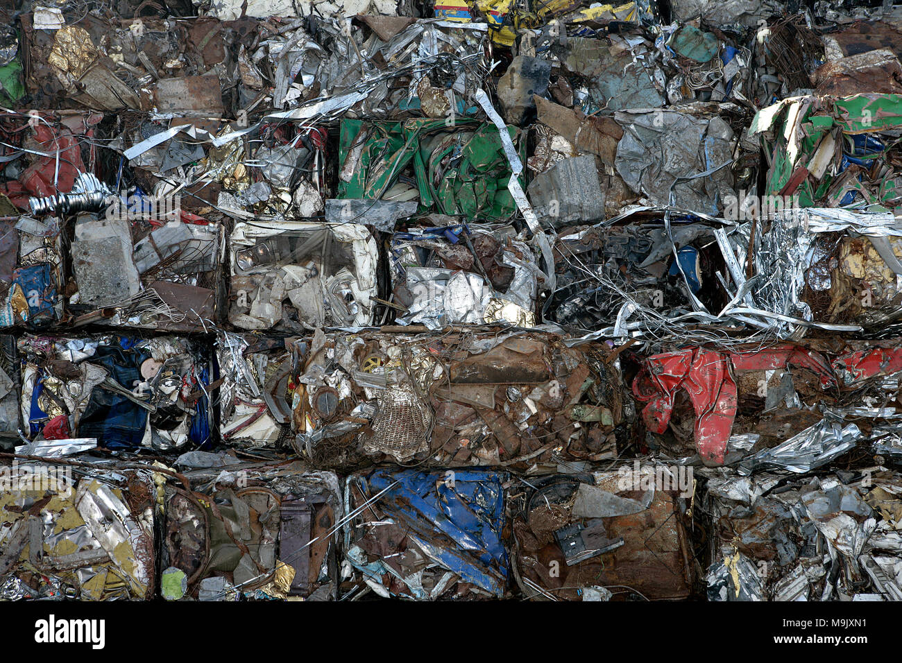 Piles of scrap metal bundled in bales Stock Photo - Alamy