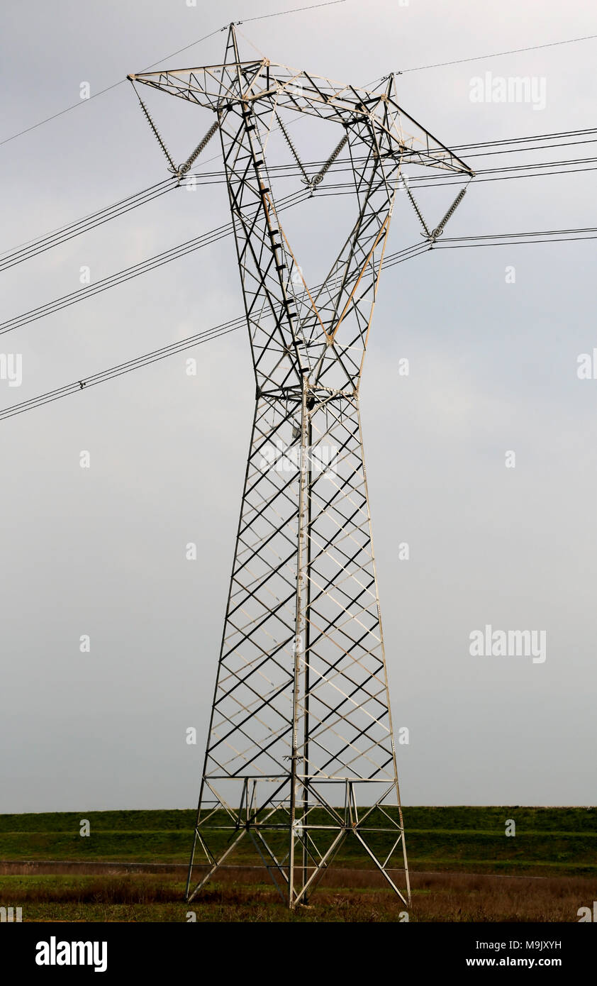 high voltage pylon with electric cables to transport electricity in the ...