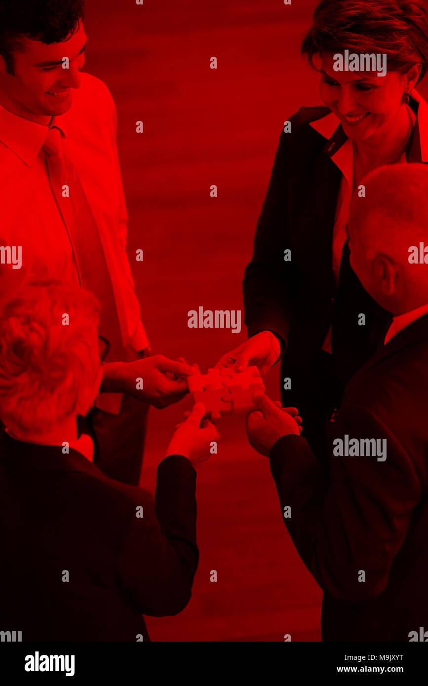 diverse business people group assembling jigsaw puzzle and represent ...