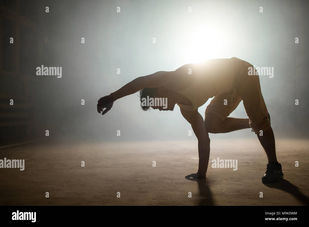 closeup photo of dancer going to do floor rocking on the ground. form ...