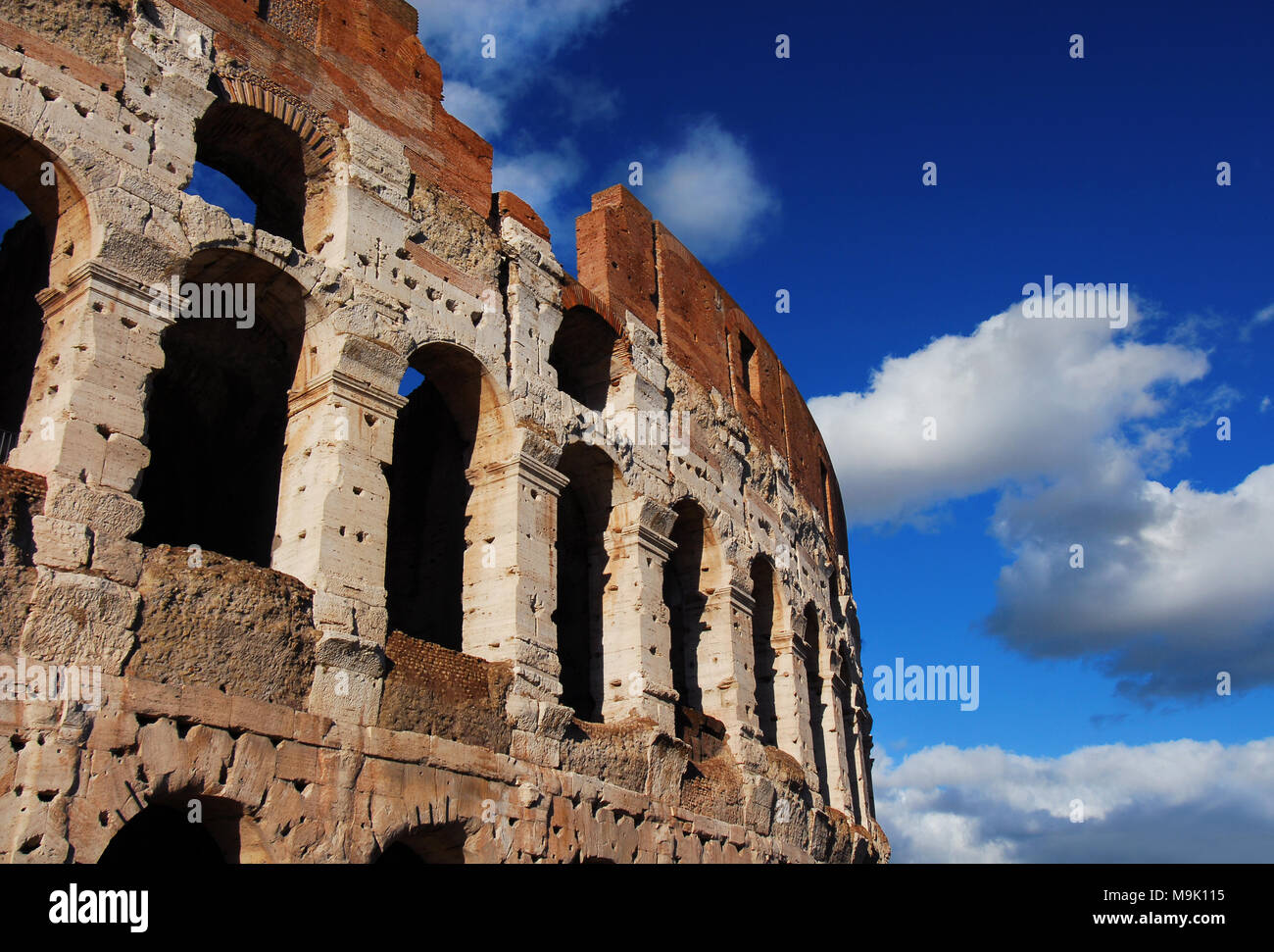 Coliseum inner ring monumental arcades with blue sky and clouds in Rome ...