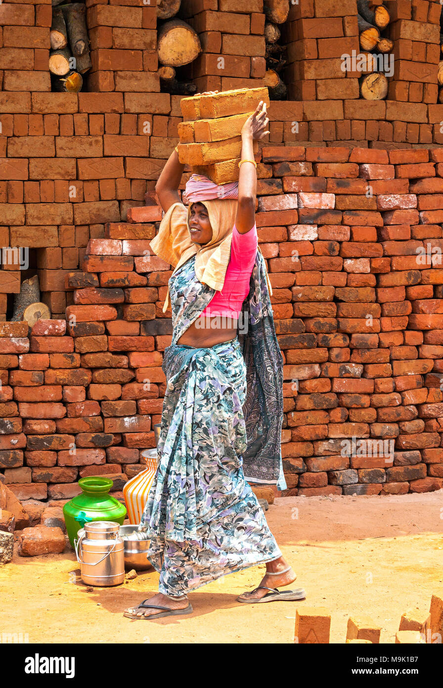 Women are employed in the heavy work of brick making industry in ...