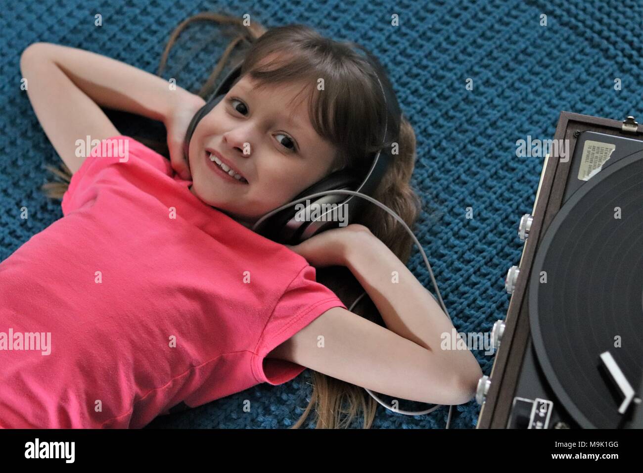 Child listening to music Stock Photo - Alamy