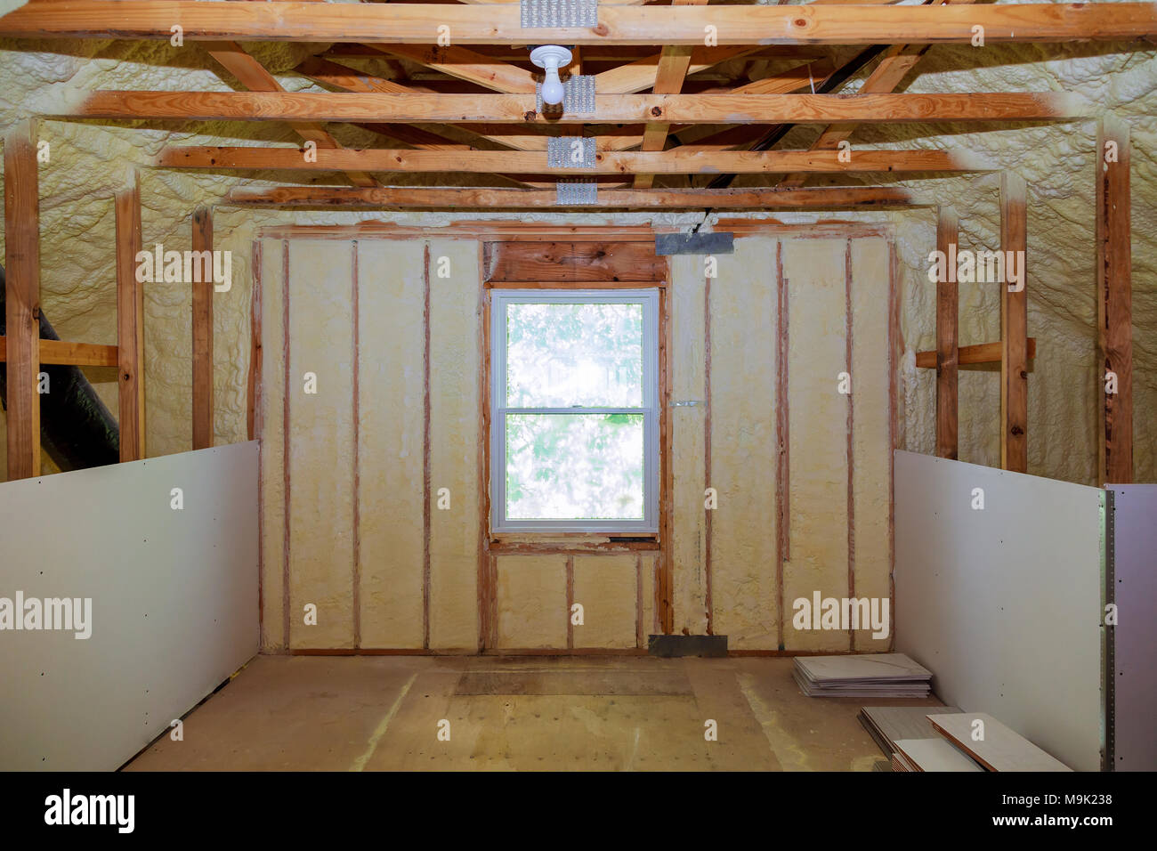 Insulation of attic with fiberglass cold barrier and insulation ...